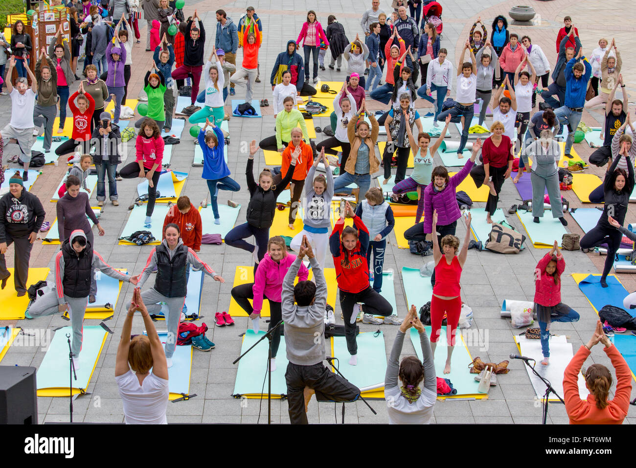Russia, Vladivostok, 06/18/2016. Yoga trainers present yoga's asana on ...