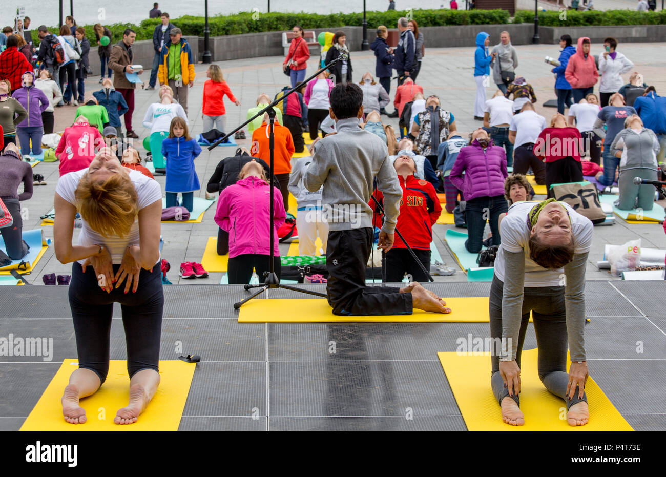 Russia, Vladivostok, 06/18/2016. Yoga trainers present yoga's asana on ...