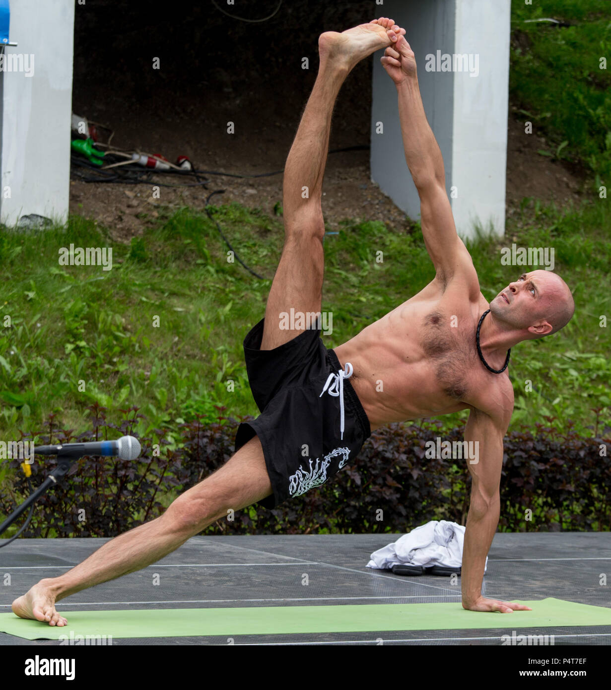 Russia, Vladivostok, 06/18/2016. Caucasian trainer presents yoga's ...