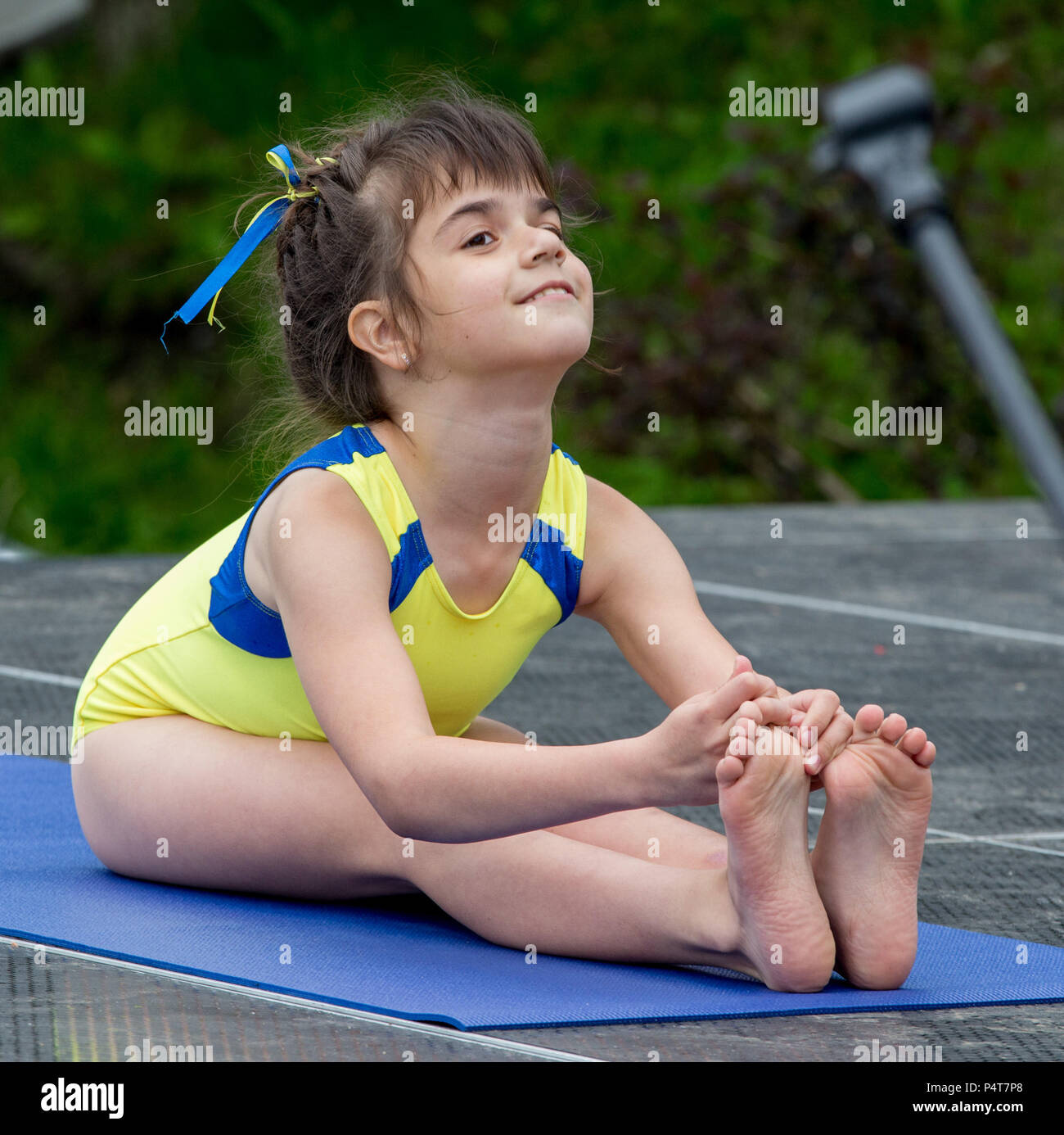 Russia, Vladivostok, 06/18/2016. Young caucasian girl presents yoga's ...