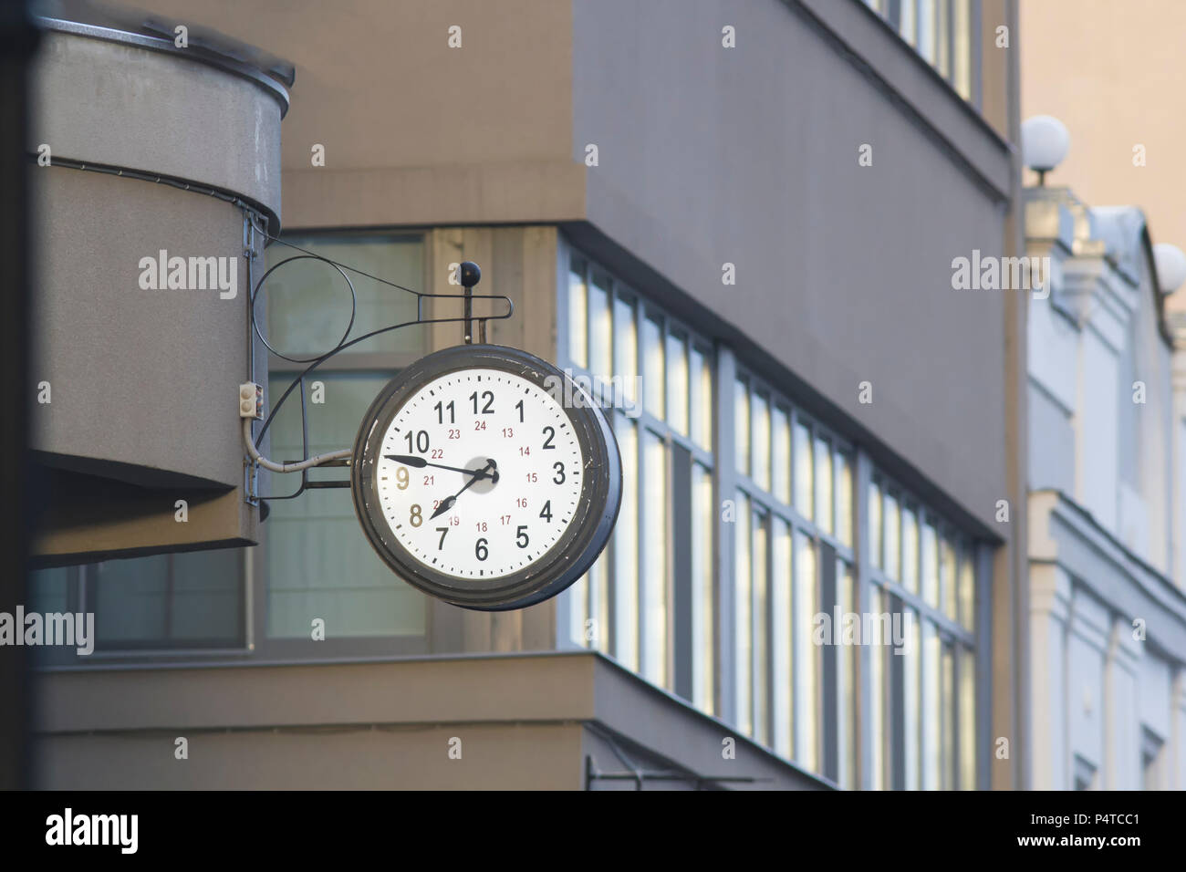 Vintage street clock on the city building Stock Photo - Alamy