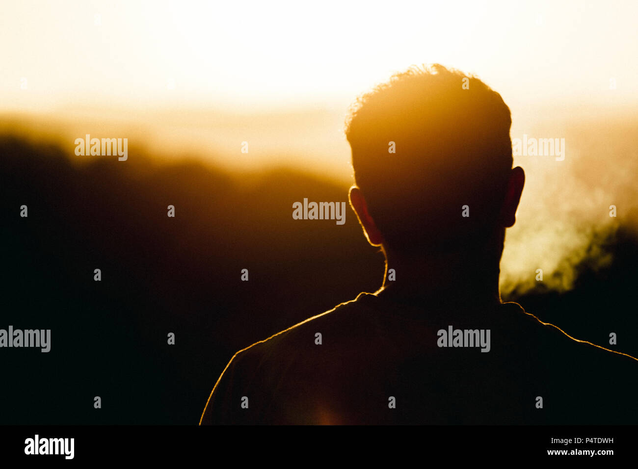 Silhouette man watching sun set hi-res stock photography and images - Alamy