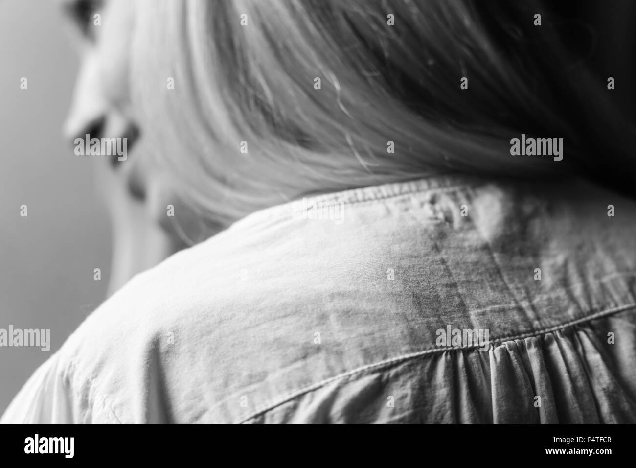 Portrait of young smiling girl in blur. Back view with emphasis on ...