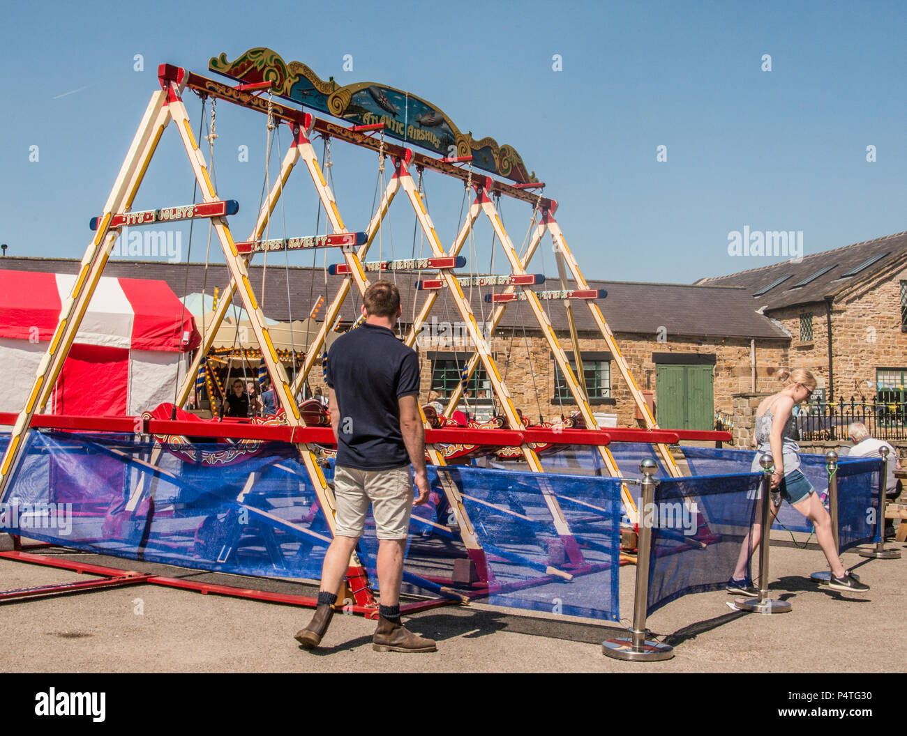 Swing boats at fairground hi-res stock photography and images - Alamy