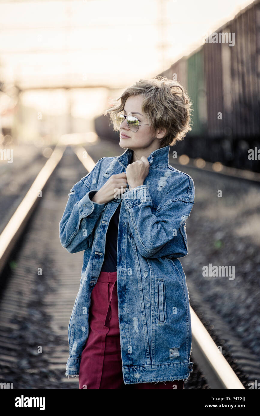 girl posing on the railroad, portrait, artistically crafted photograph ...