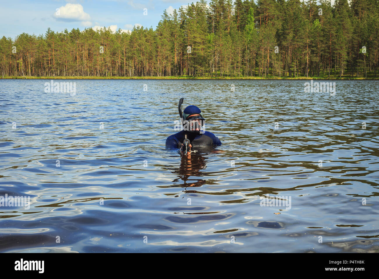 Underwater hunter preparing to dive. Fishing on a forest lake Stock ...