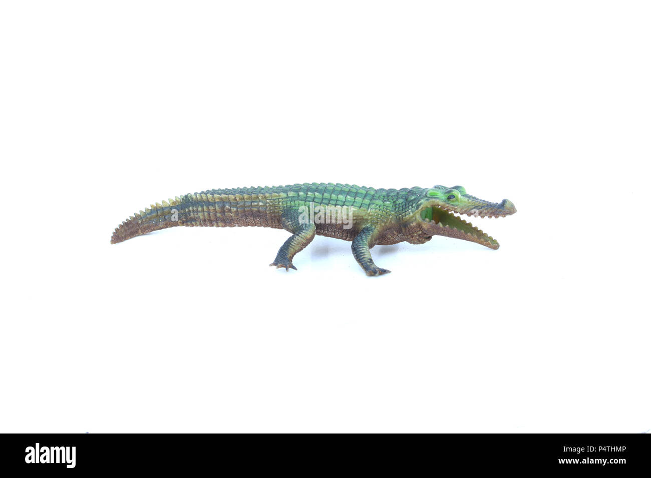 crocodile toy on isolated Stock Photo - Alamy
