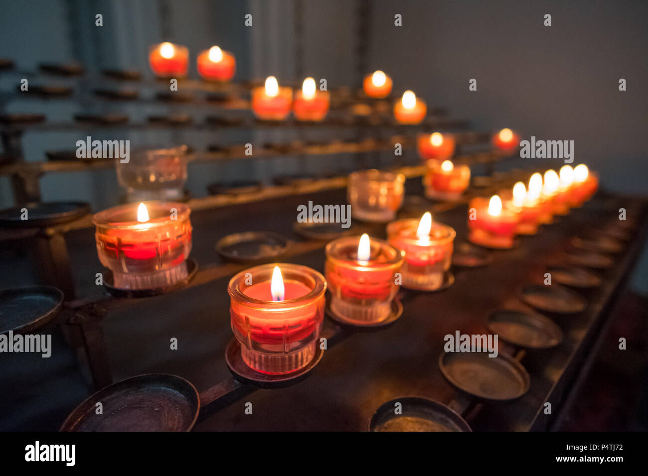 Red Burning Candles in the dark, in the Church Stock Photo - Alamy
