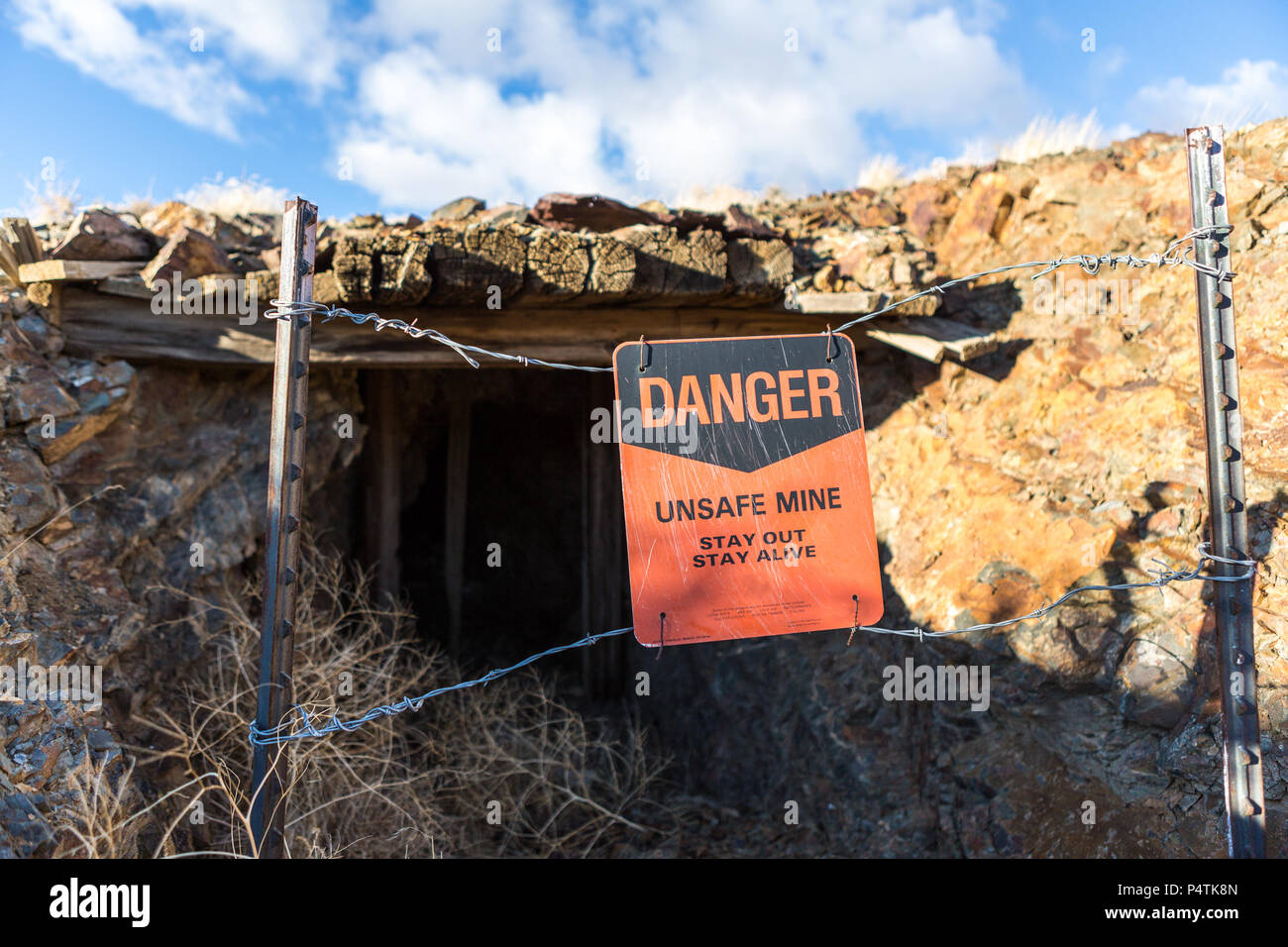 Entrance to a mining shaft barred with stay out sign Stock Photo - Alamy