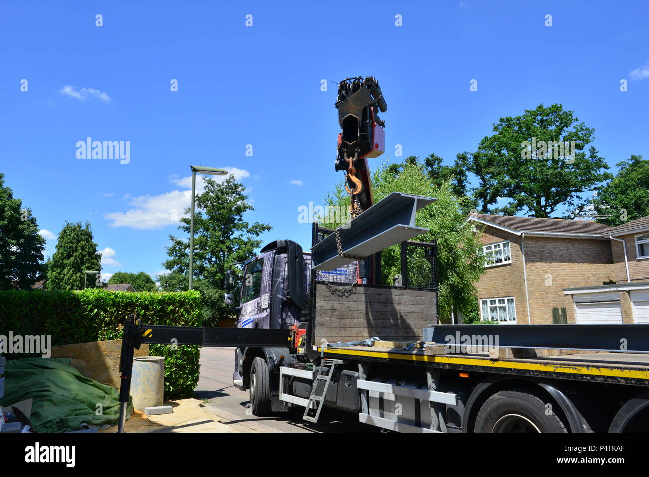 A crane lifting a girder into position Stock Photo - Alamy