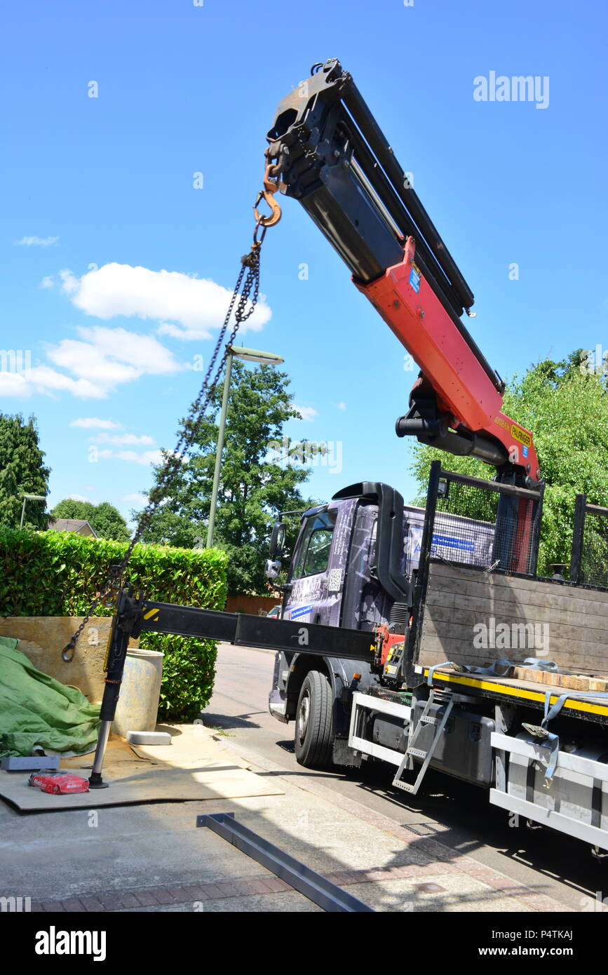 A crane lifting steel for an extension on a house in the UK Stock Photo ...