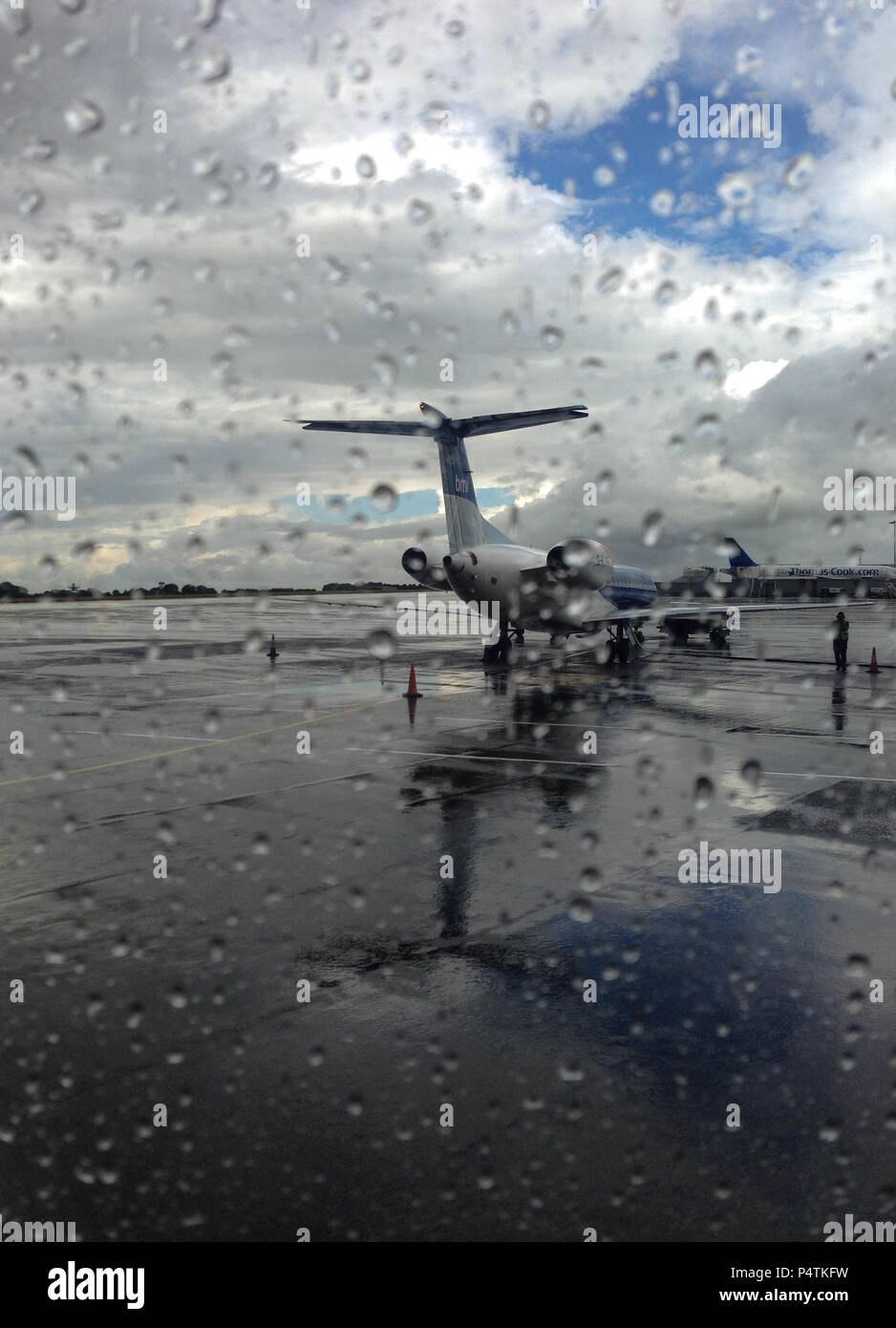 Aeroplane refuelling at airport in the bad weather. London, England, UK ...
