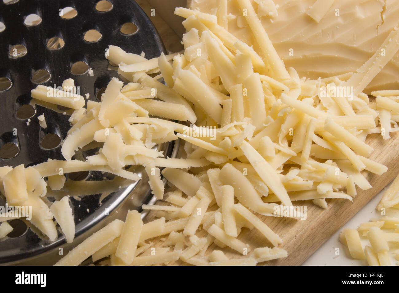 delicious grated irish organic mature cheddar cheese Stock Photo - Alamy