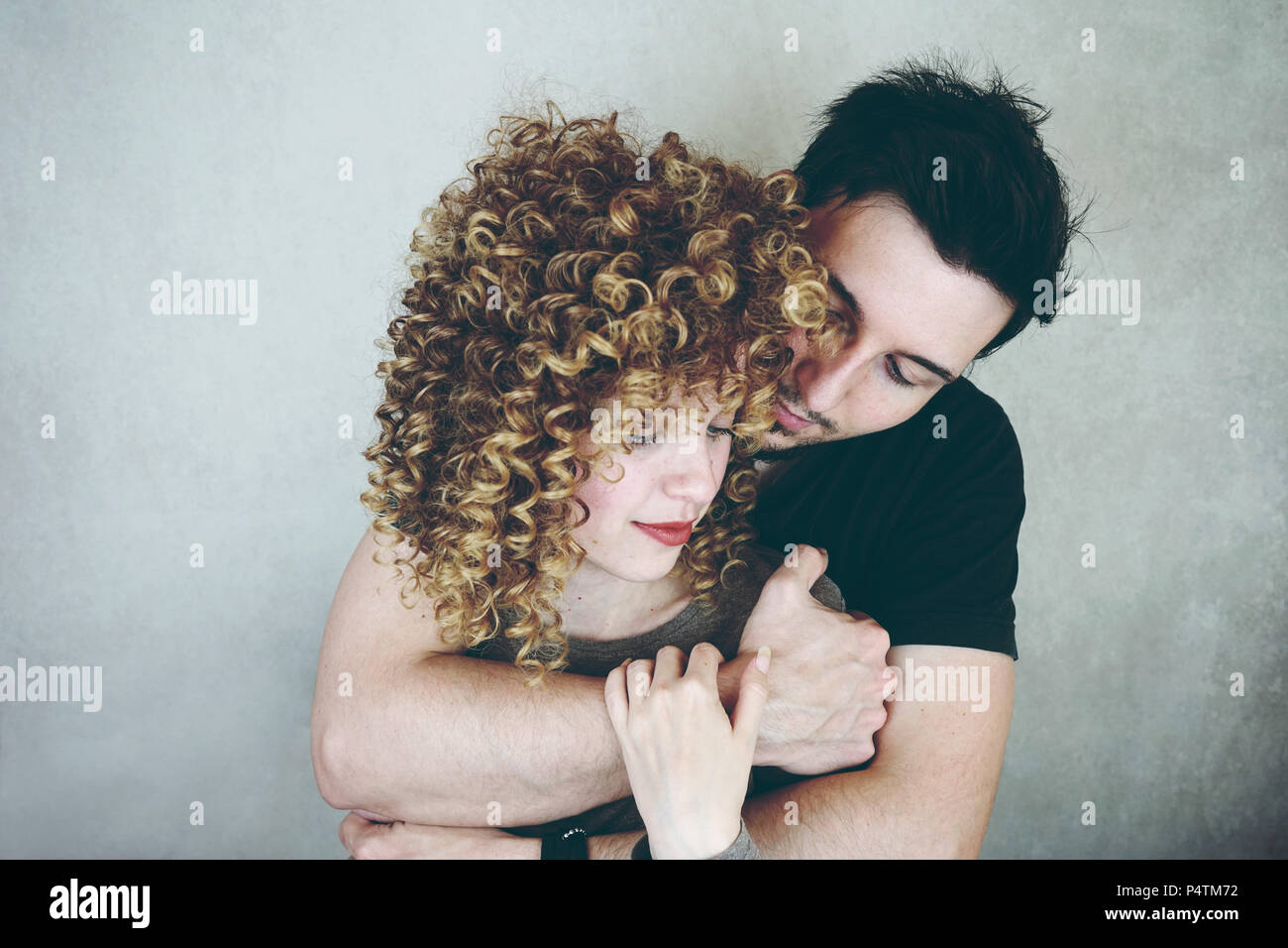 Young in love couple posing together Stock Photo - Alamy