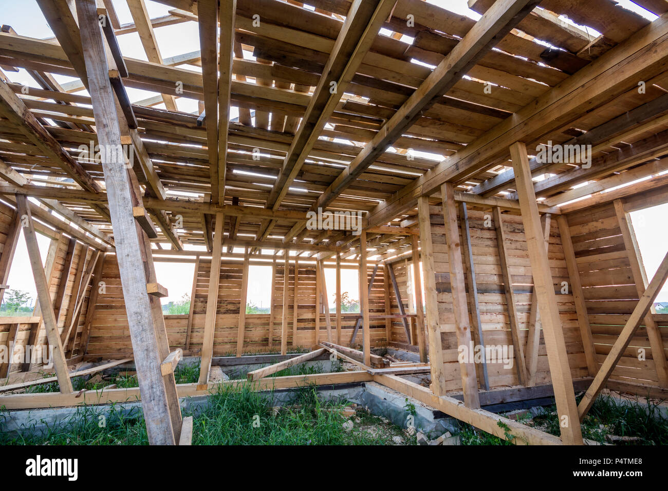 New wooden house under construction. Close-up of walls and ceiling ...