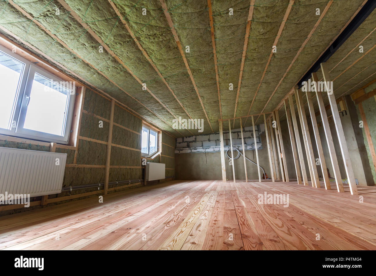 Construction and renovation of big light spacious empty room with oak ...