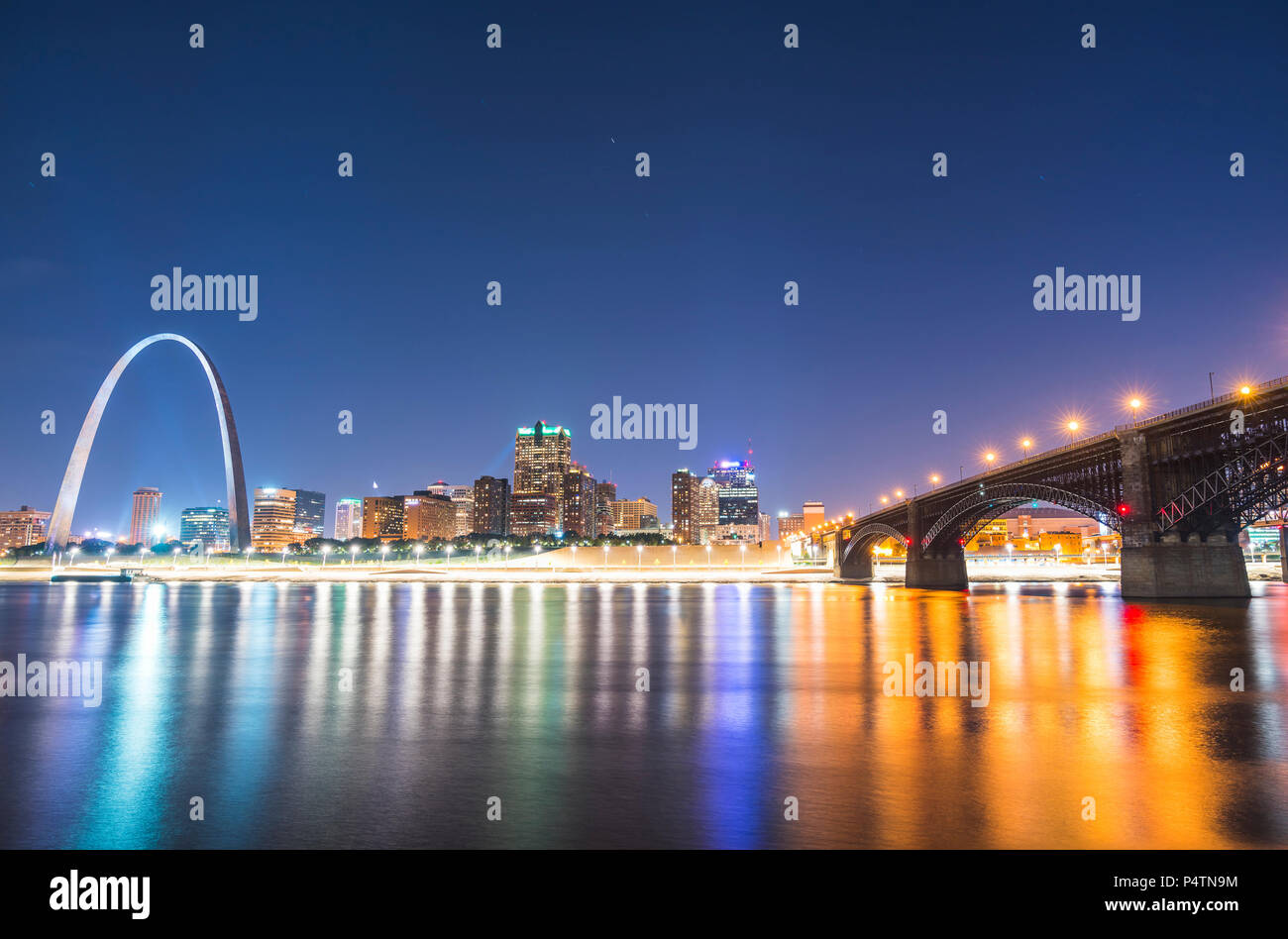 st. louis skyscraper at night with reflection in river,st. louis ...