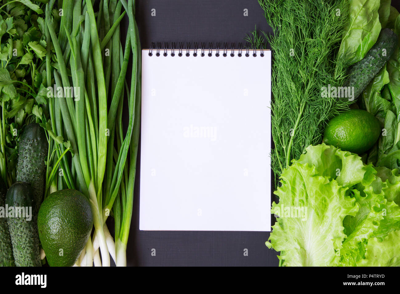Green vegetables and fruits background (avocado, lime, cabbage, parsley ...