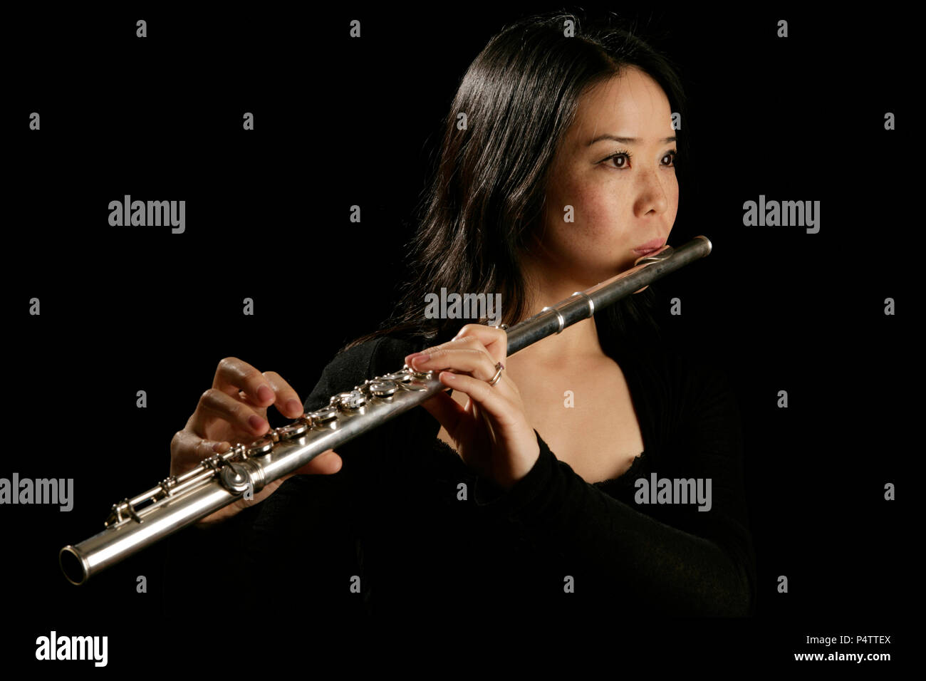 Lady playing flute hi-res stock photography and images - Alamy