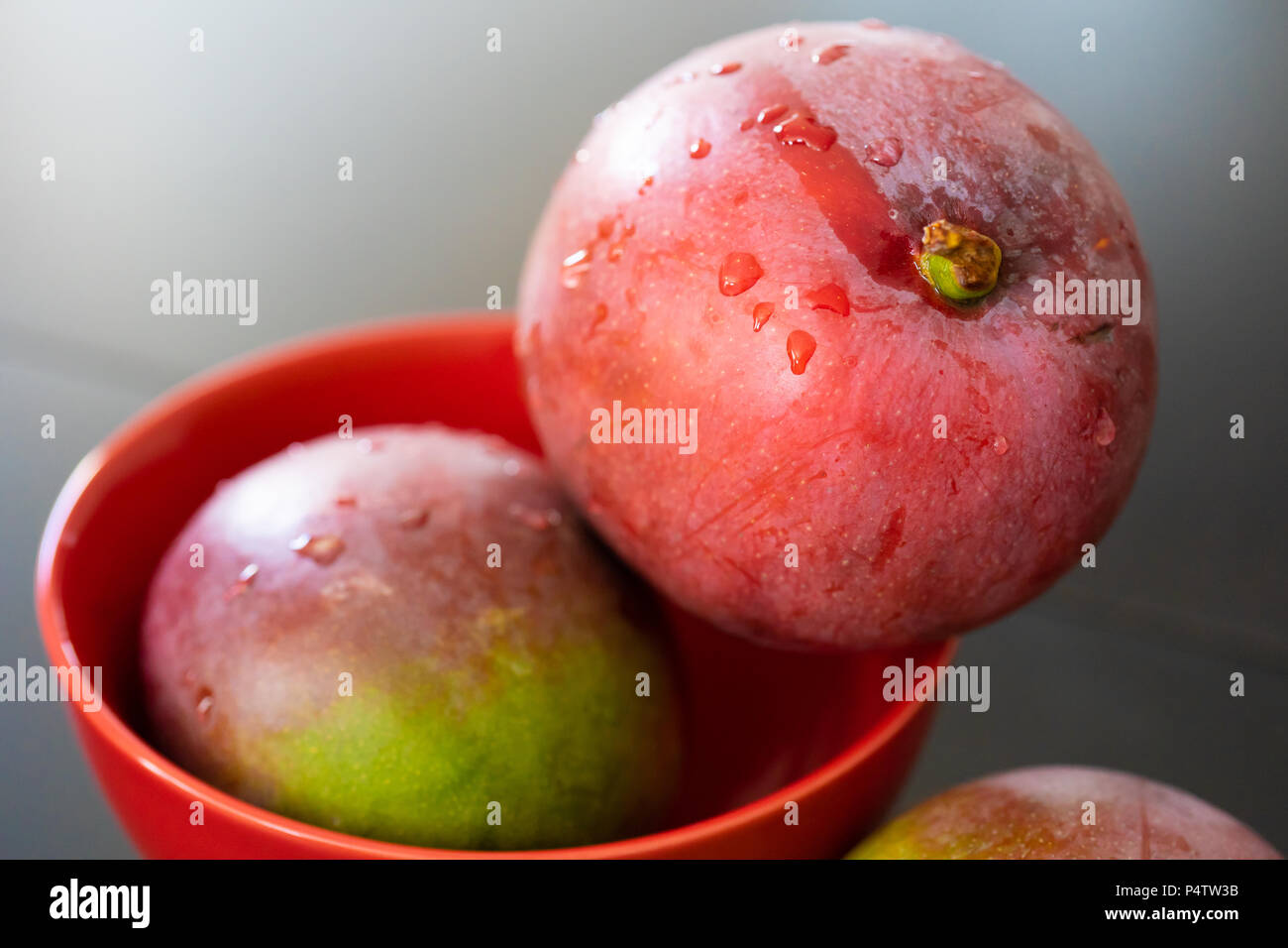 Fresh Red mangoes in Bowl Close Focus Stock Photo - Alamy