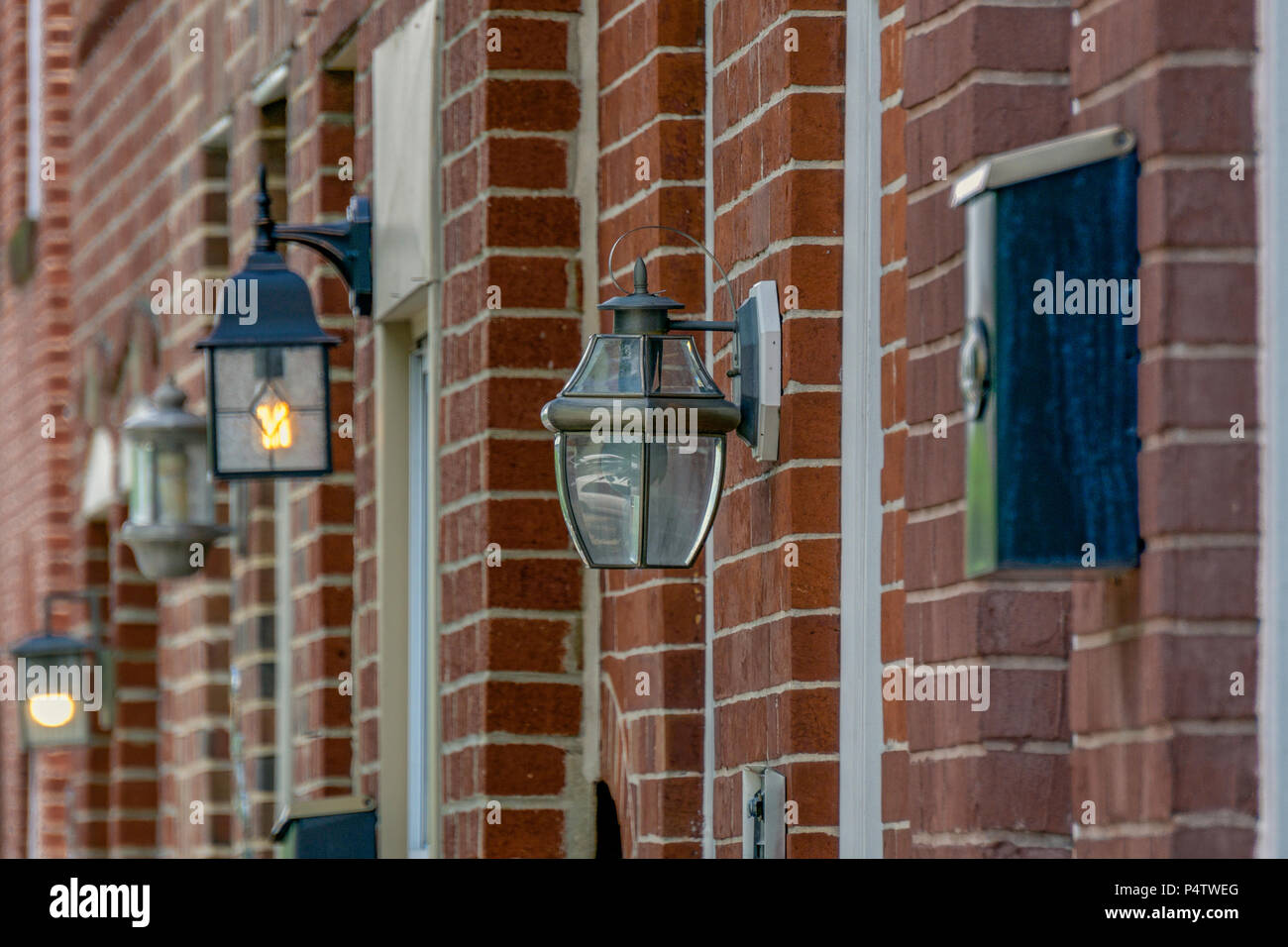 street lights on a brick wall Stock Photo - Alamy