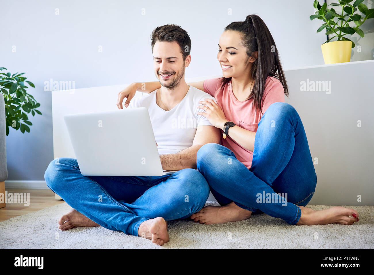 Couple using laptop hi-res stock photography and images - Alamy