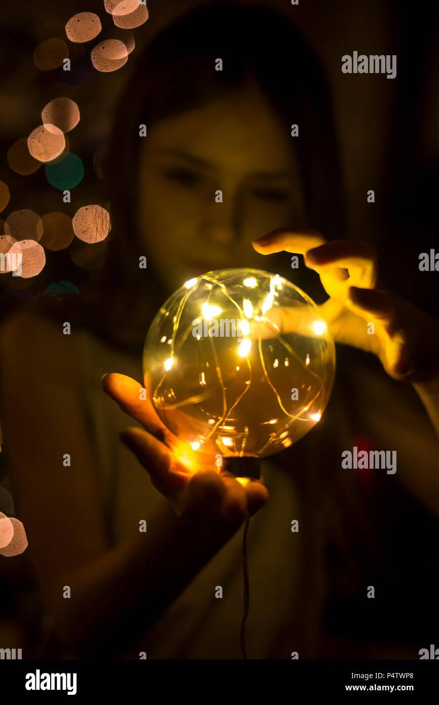 Girl with shining crystal ball Stock Photo - Alamy