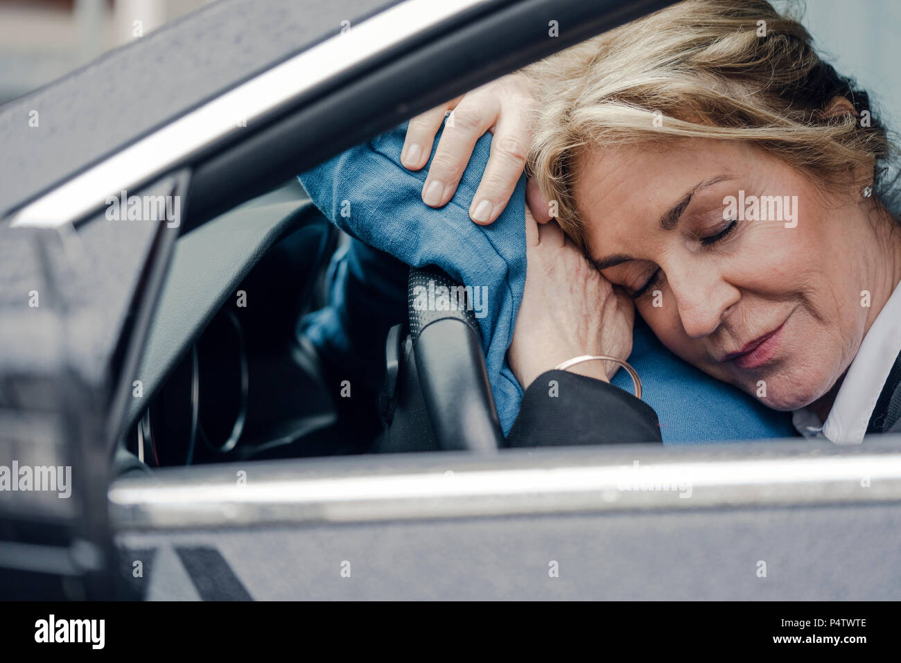 Woman sleeping on wheel hi-res stock photography and images - Alamy