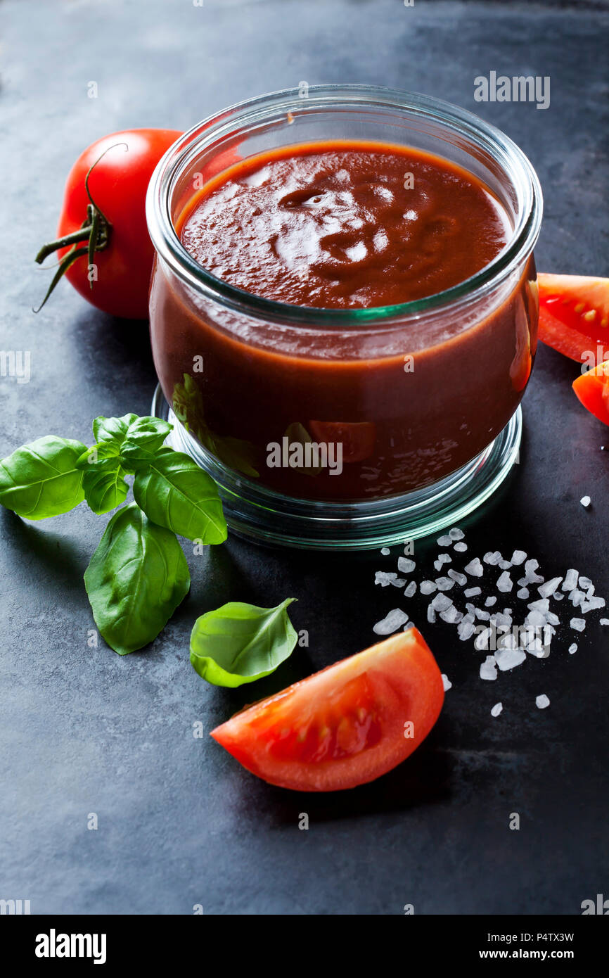 Glass of sieved tomatoes Stock Photo - Alamy