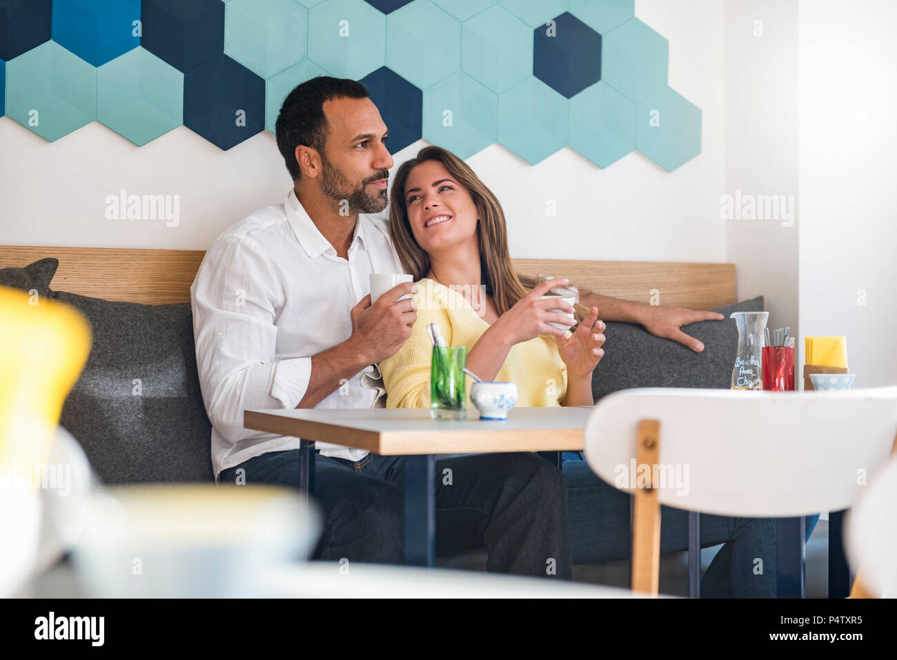 Couple in love drinking coffee in a cafe Stock Photo - Alamy
