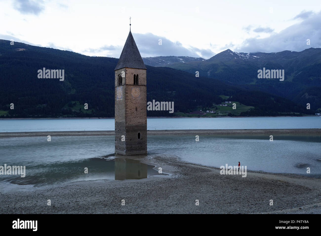 Church under water, drowned village, mountain landscape and peaks in ...