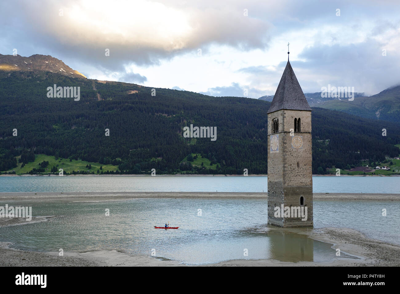Church under water, drowned village, mountain landscape and peaks in ...