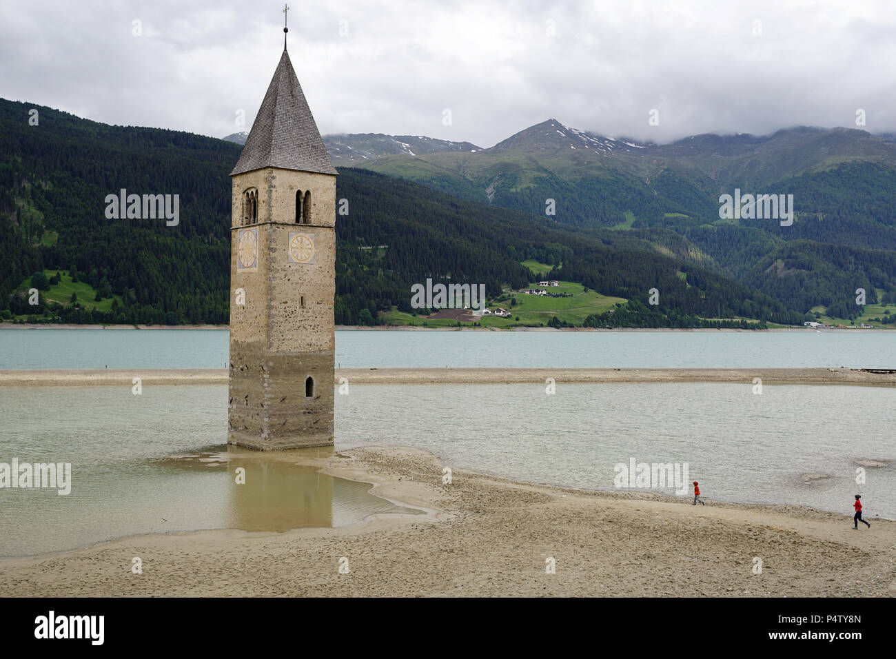 Church under water, drowned village, mountain landscape and peaks in ...