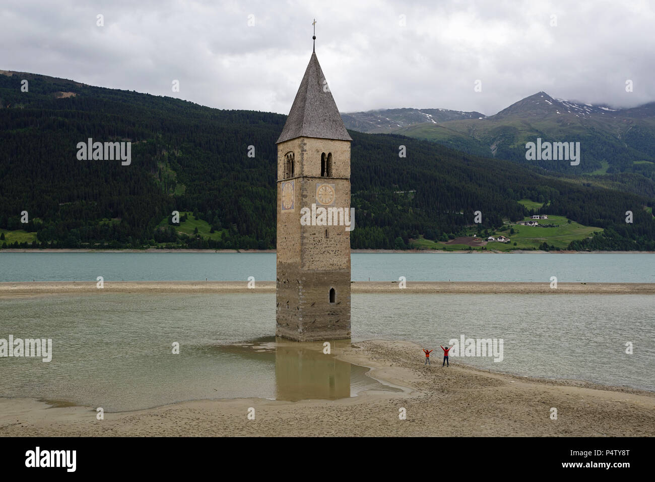 Church under water, drowned village, mountain landscape and peaks in ...