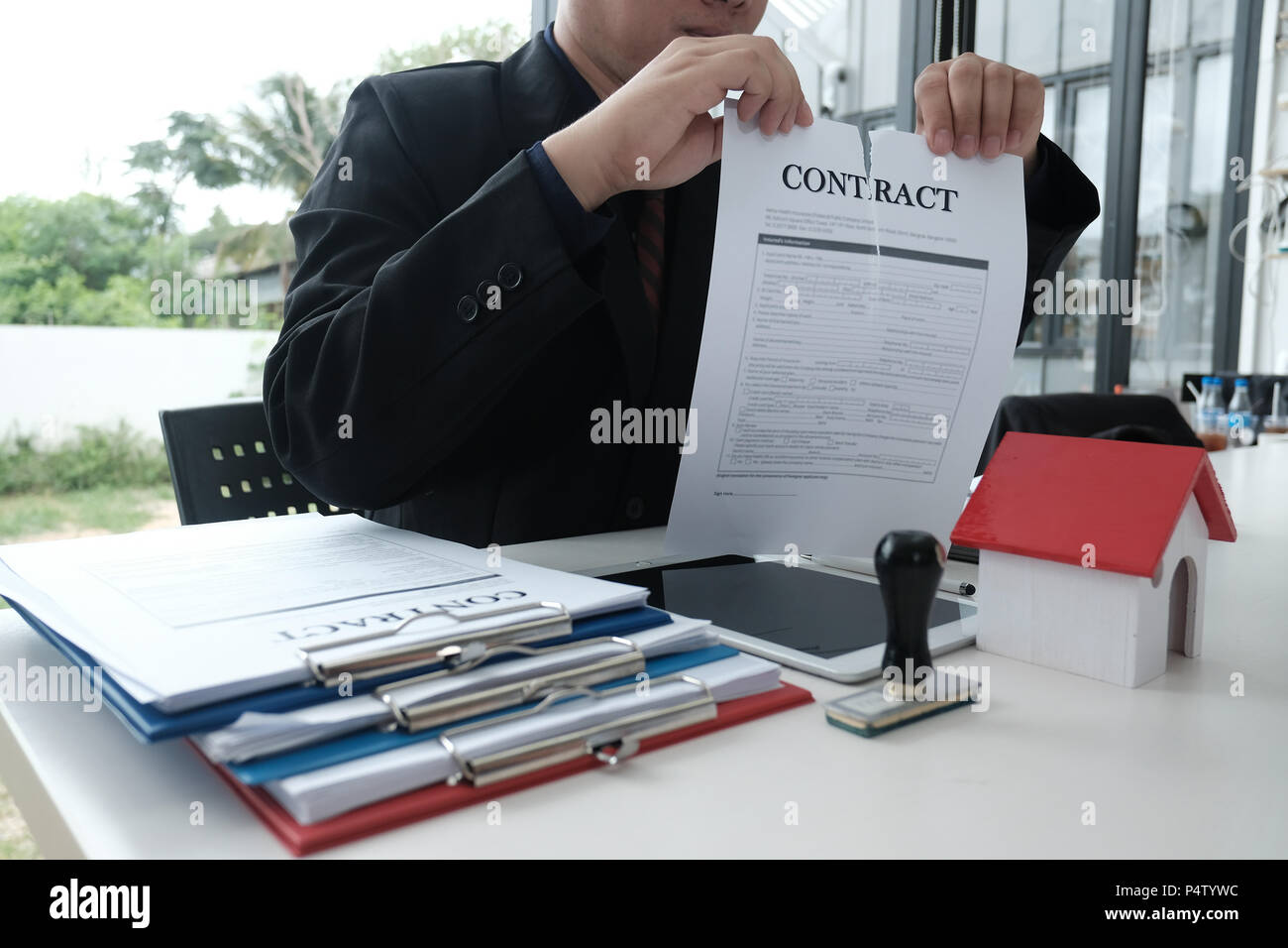 businessman tearing agreement document. breaking contract at office ...