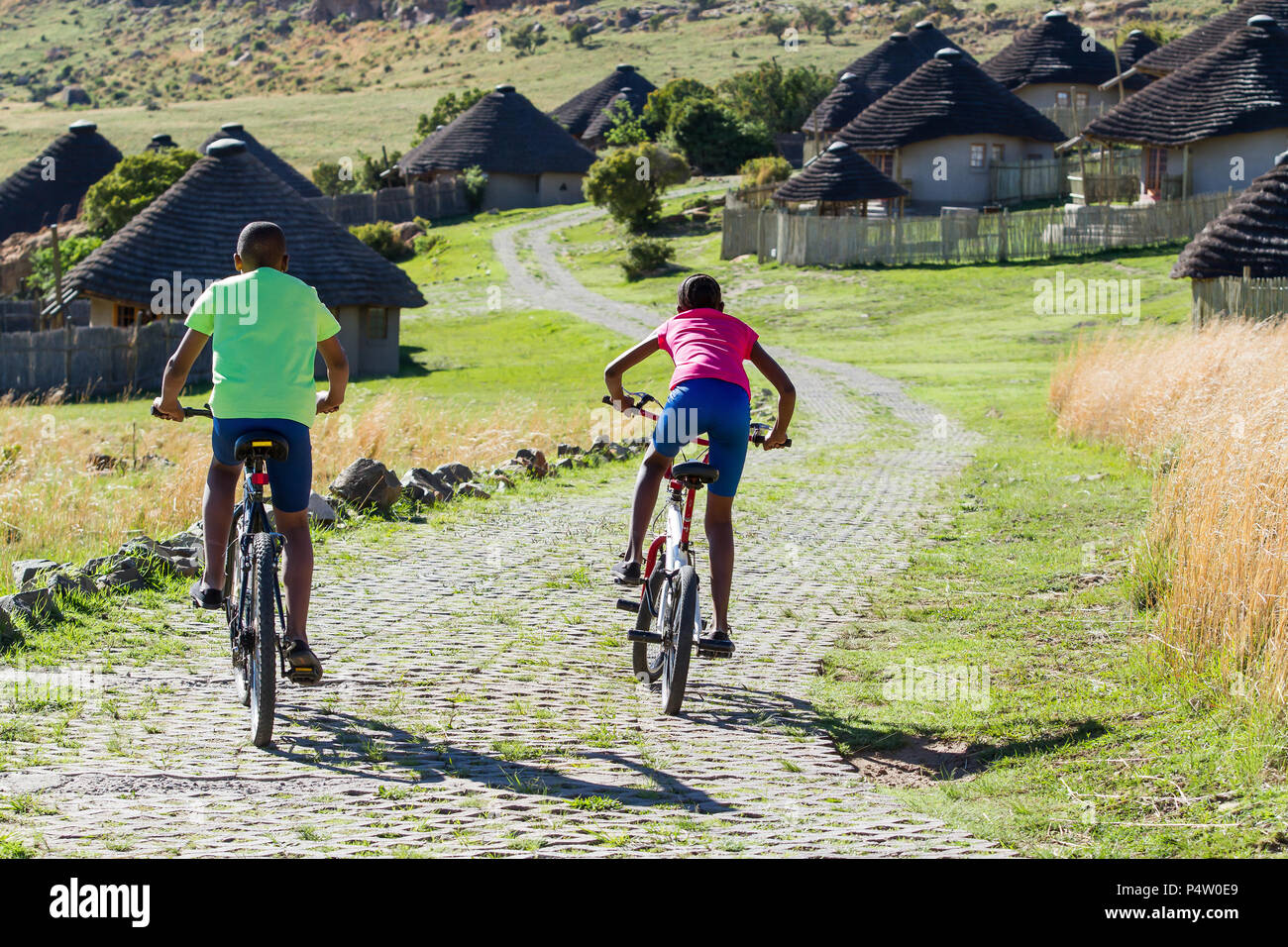 African Children riding bikes in a rural village in South Africa Stock ...