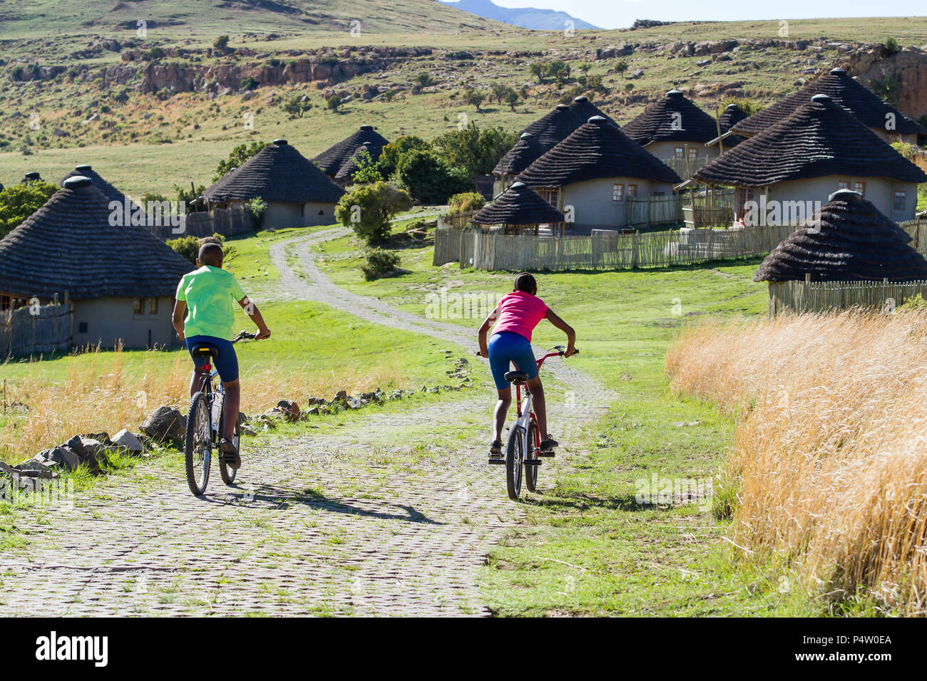 African Children riding bikes in a rural village in South Africa Stock ...