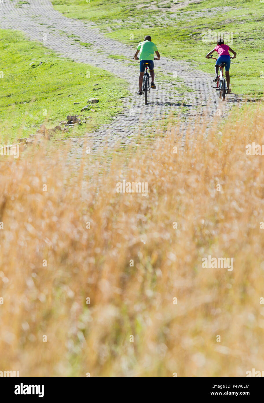 African Children riding bikes in a rural village in South Africa Stock ...