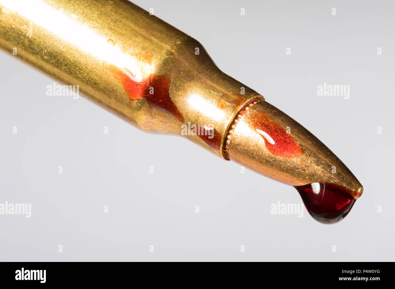 Blood drop on the end of the bullet from an assault rifle Stock Photo ...