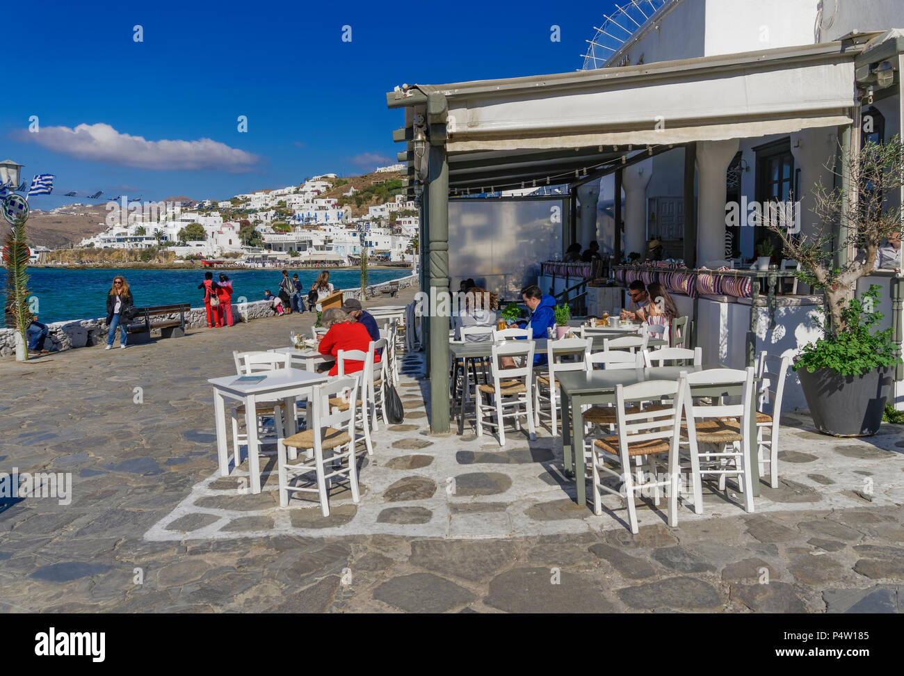 Mykonos, Greece crowd at tavern style fast food restaurant. People ...