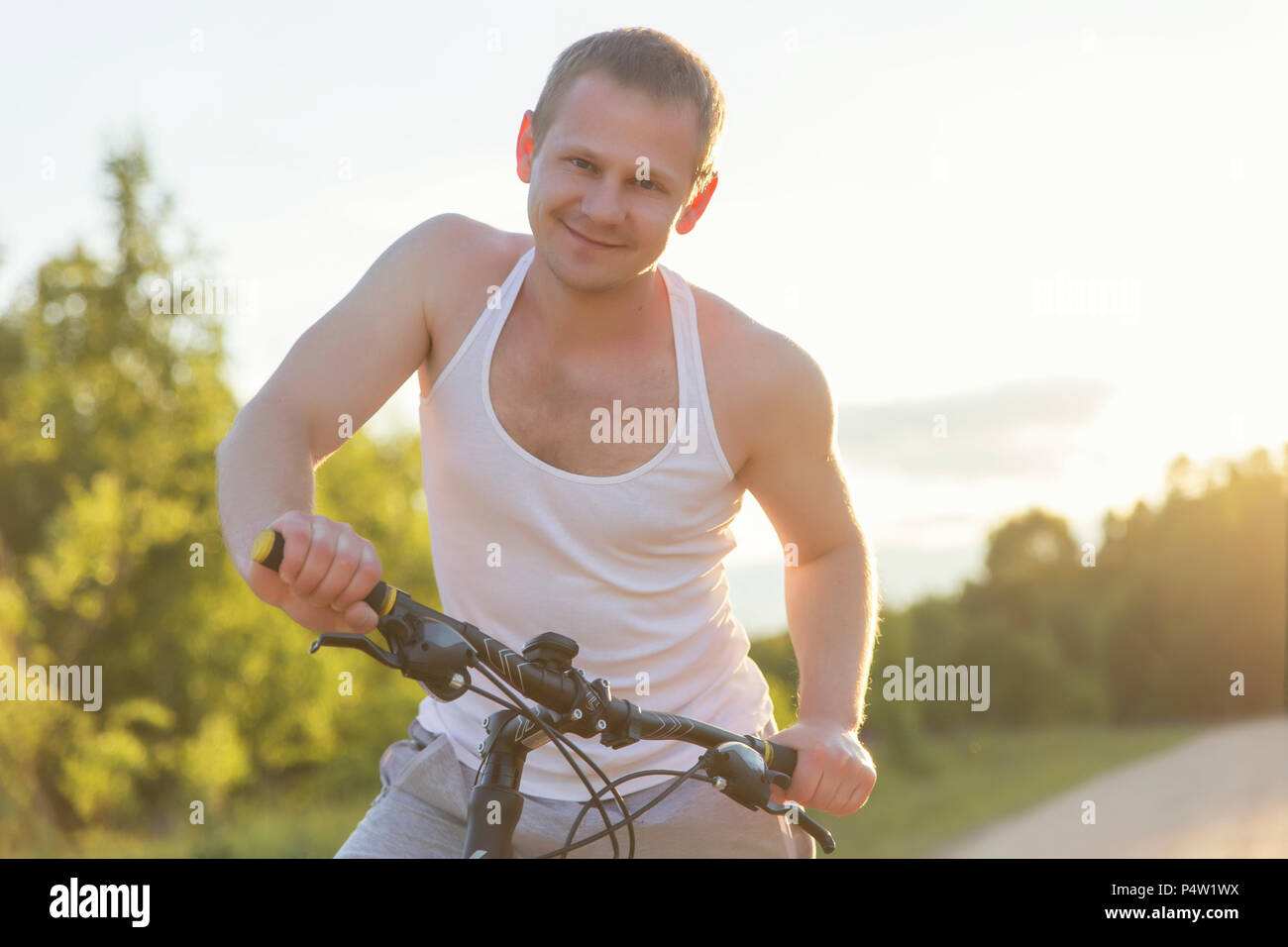 Man standing pose with cycle hi-res stock photography and images - Alamy