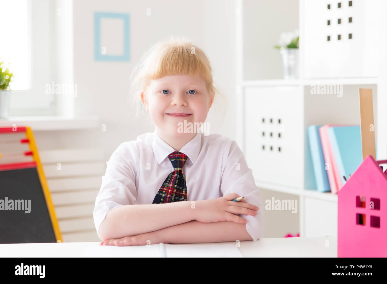 A first grader is sitting at a desk Stock Photo - Alamy