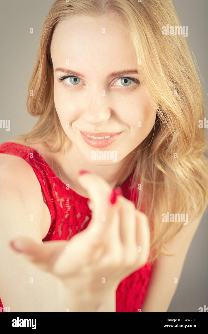 beautiful young woman point at camera smiling Stock Photo - Alamy