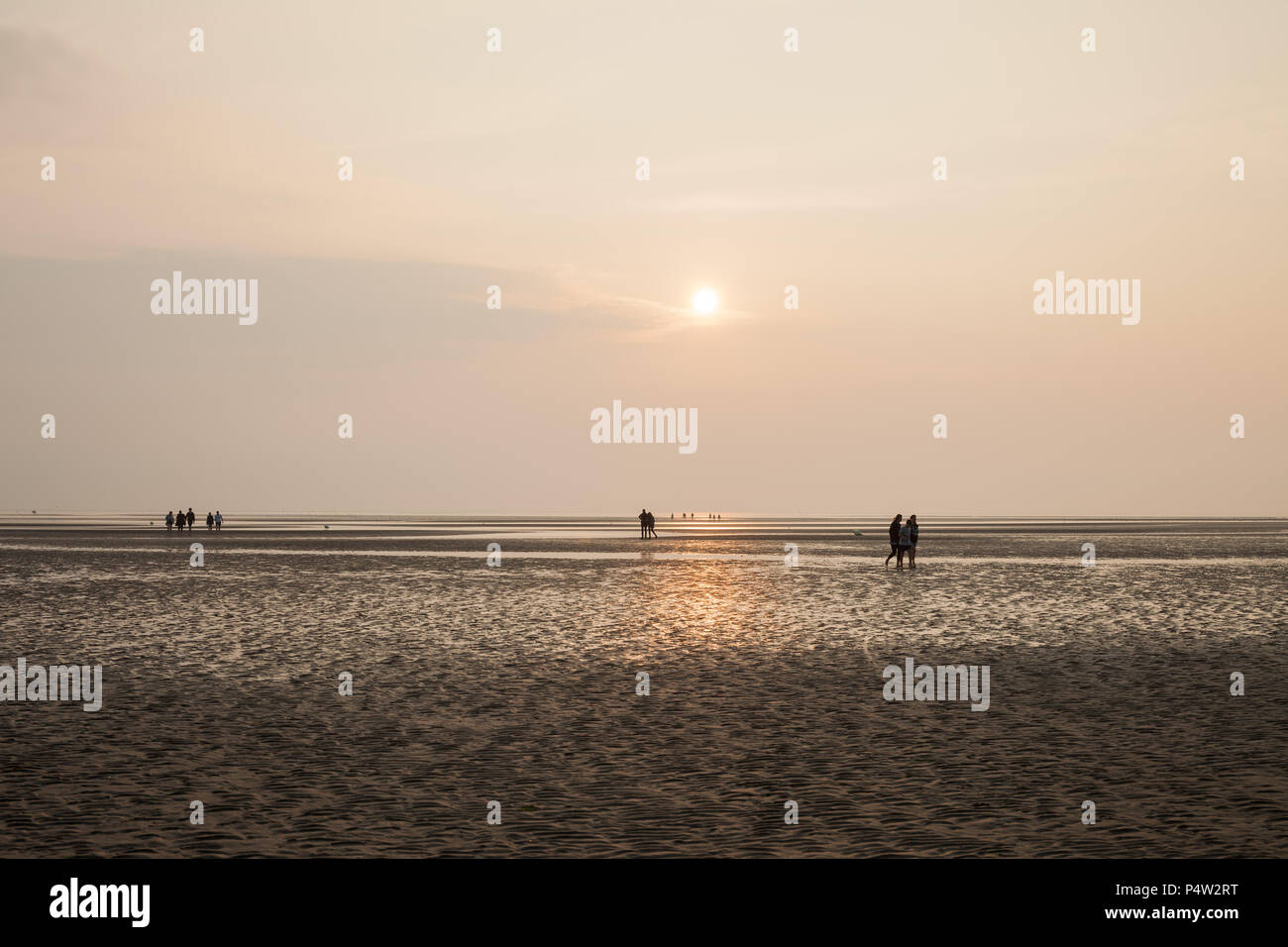St. Peter Ording, Germany, tourists at low tide on the beach of St ...