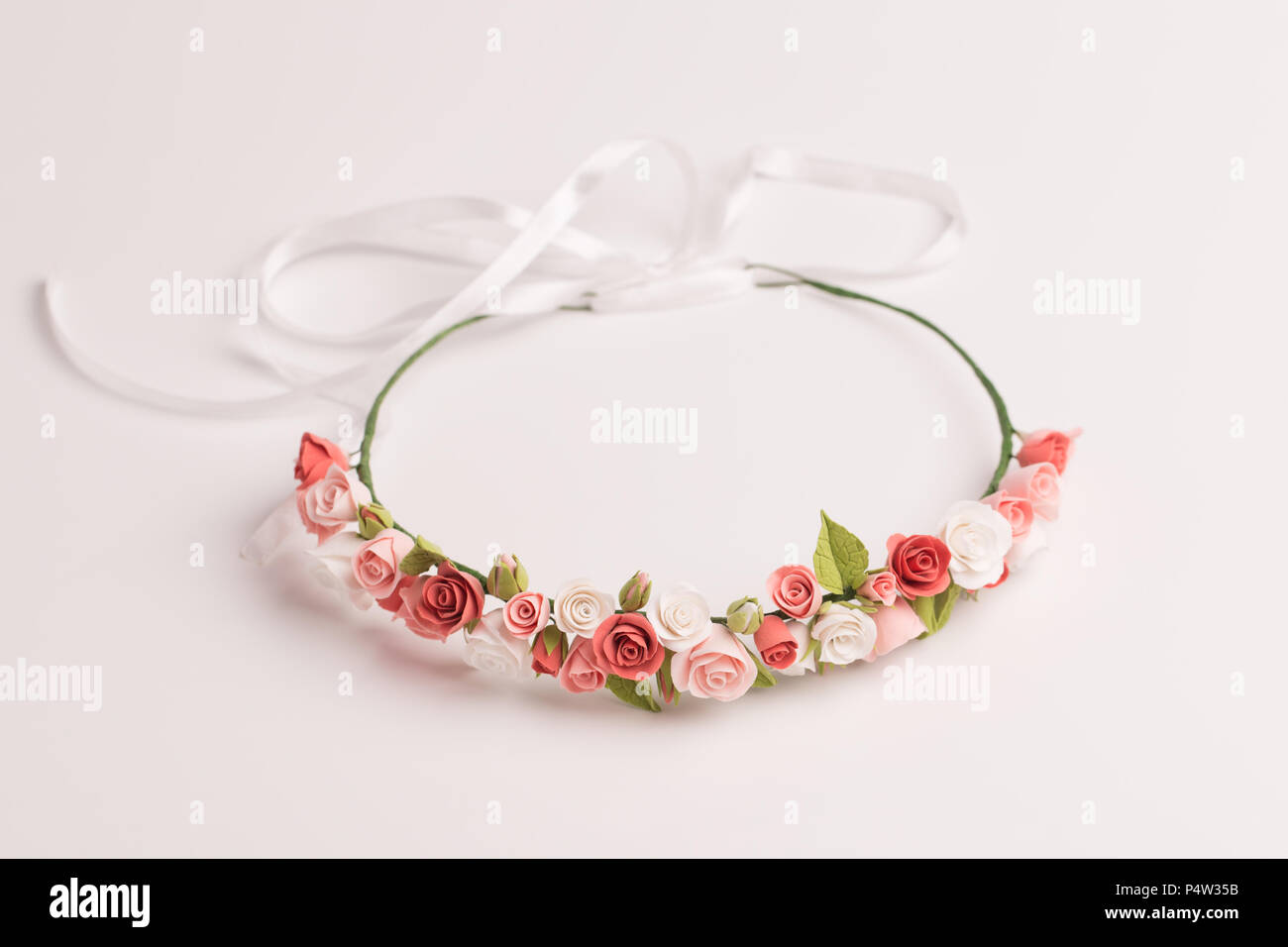 tiara with handmade flowers on a white background Stock Photo - Alamy