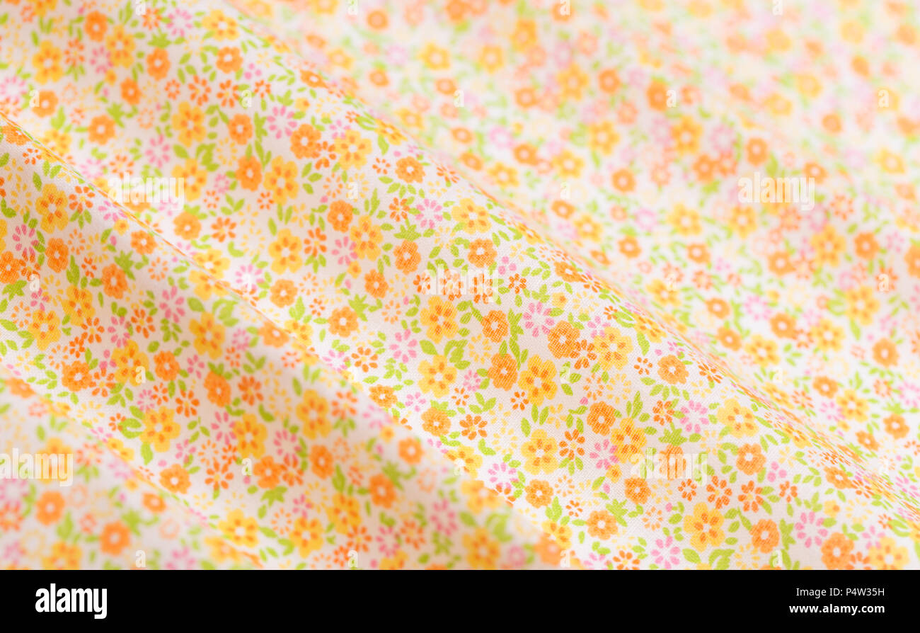 white cotton fabric with yellow floral pattern Stock Photo - Alamy