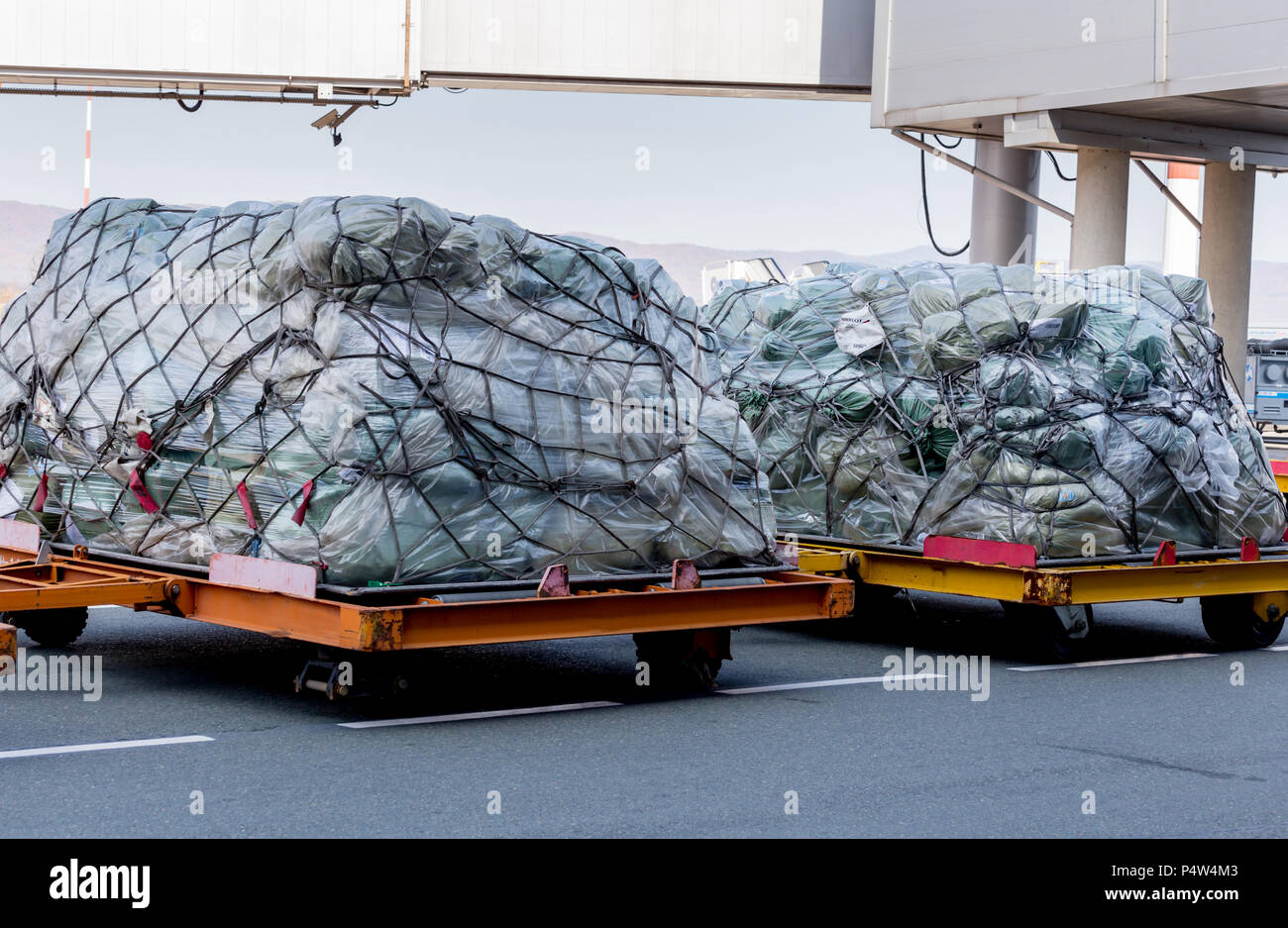Trolleys with cargo are ready to be loaded in plane. Aviation ...