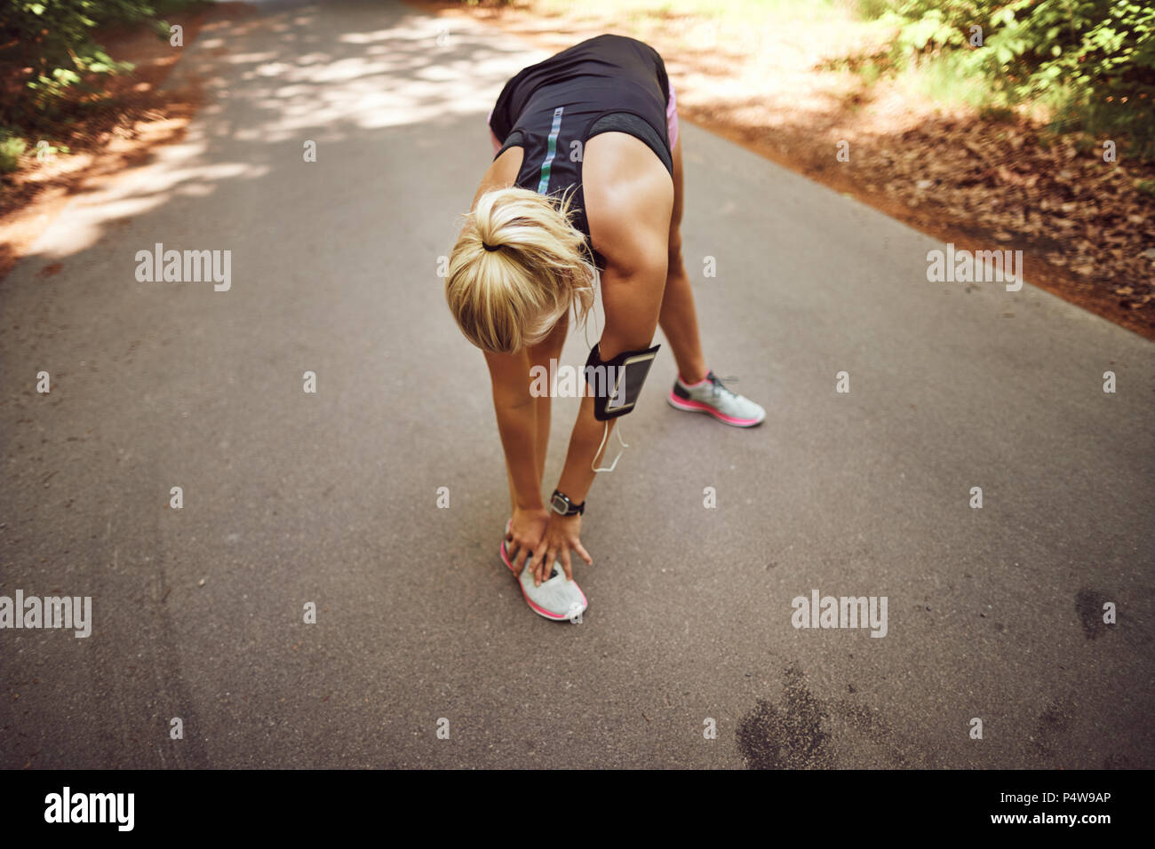 Lone female runner hi-res stock photography and images - Alamy