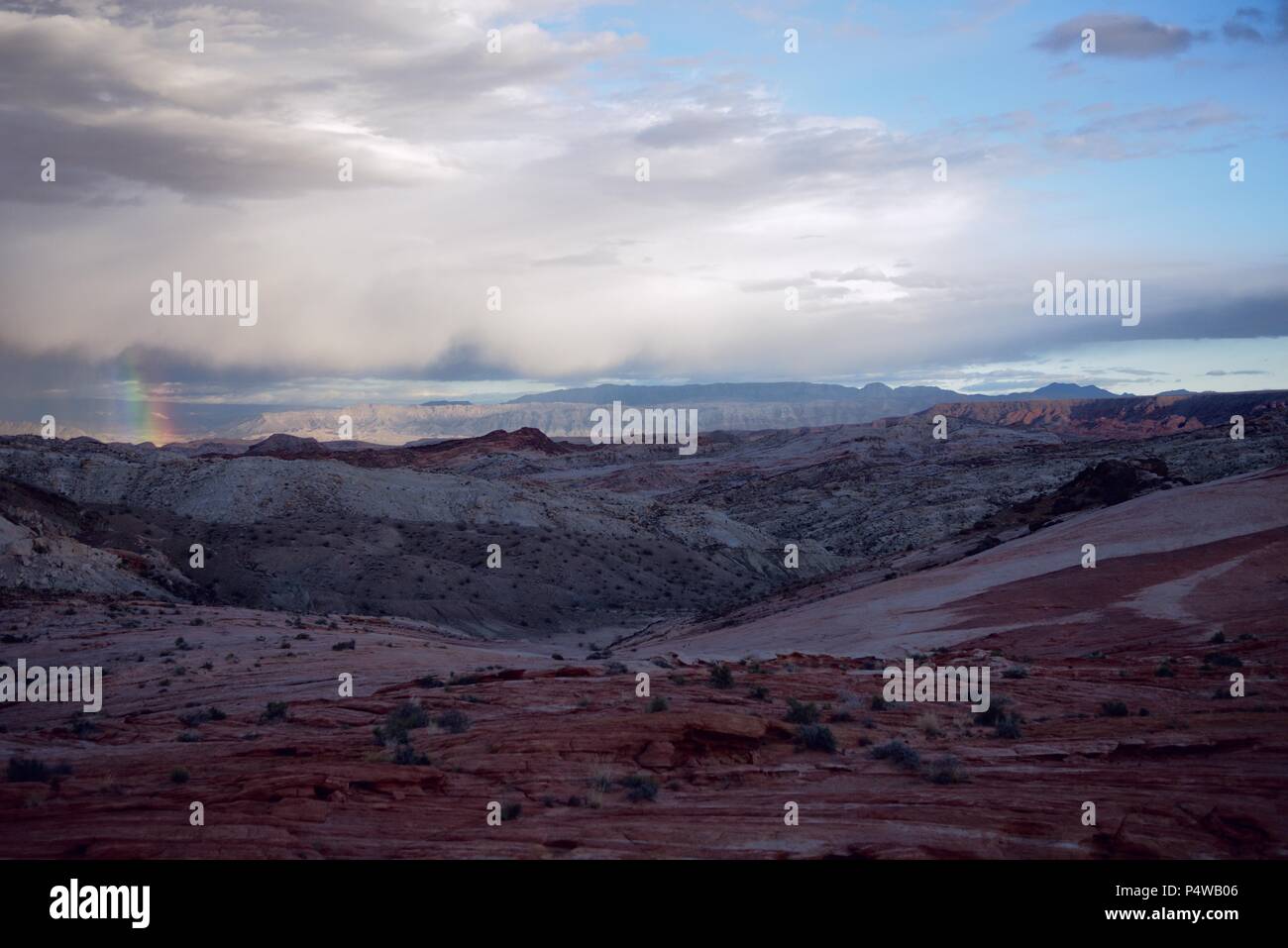 A rainbow over valley of fire state park Stock Photo - Alamy