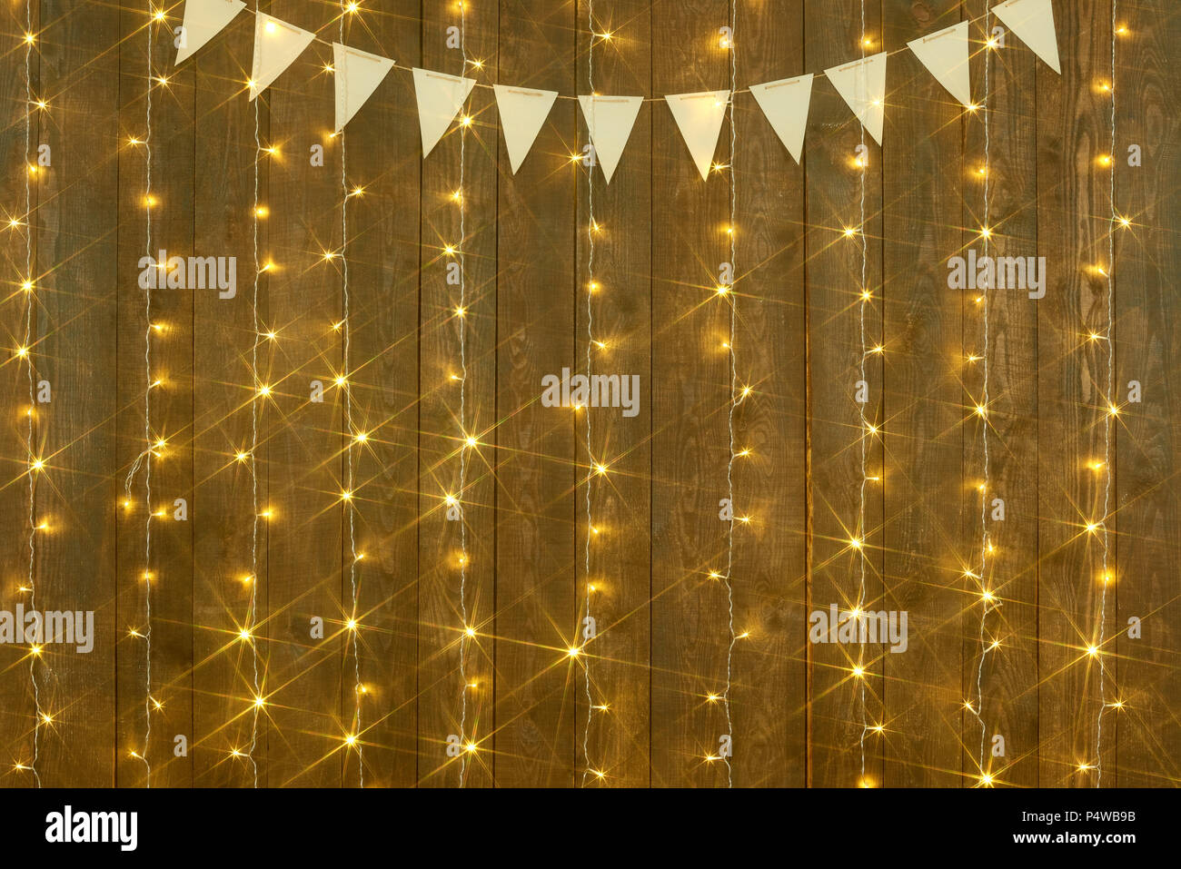 dark wood background with lights and flags, abstract holiday backdrop ...